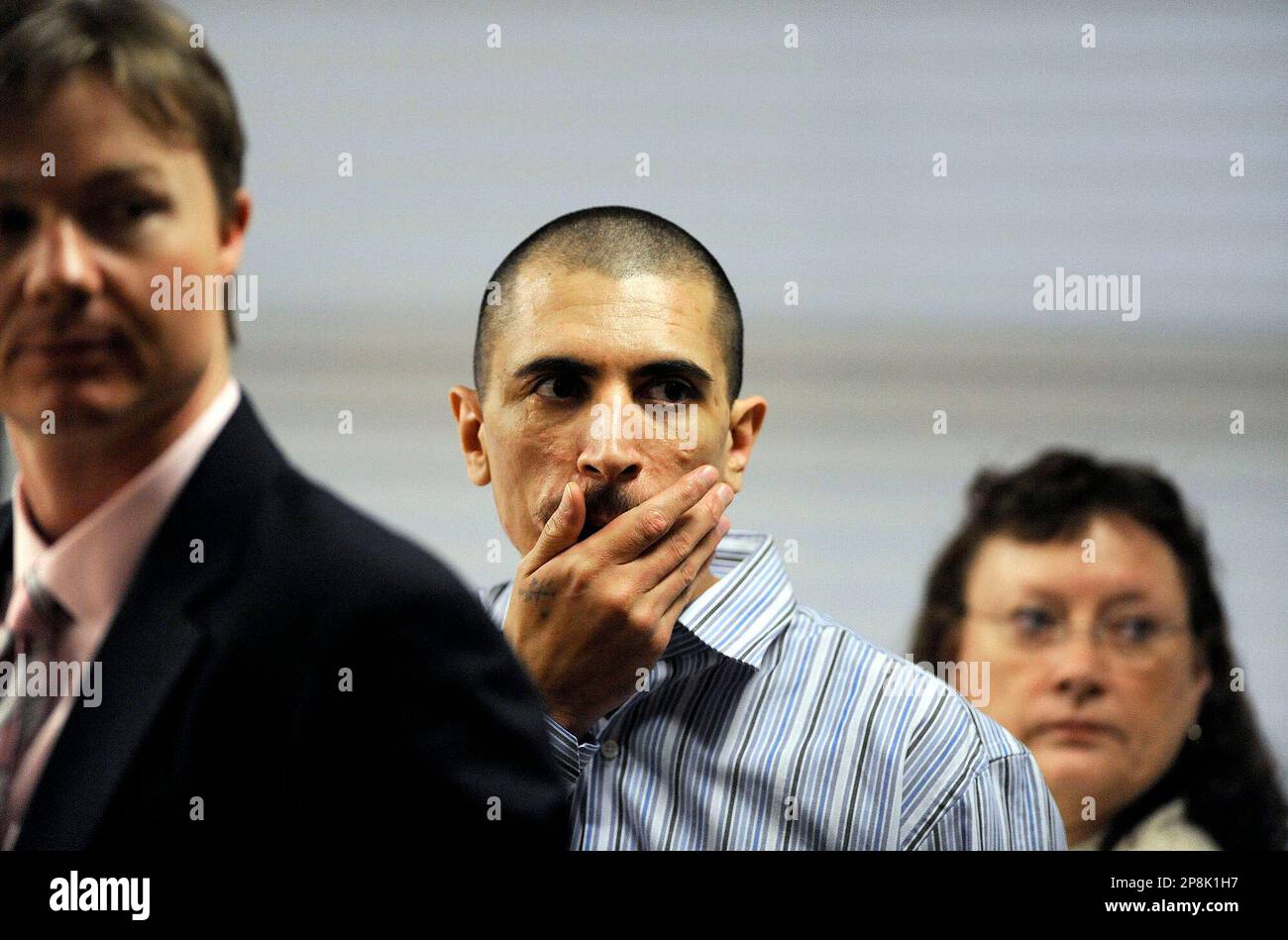 Flanked by Public Defender Brad Martin, left, and Investigator Marilynn ...