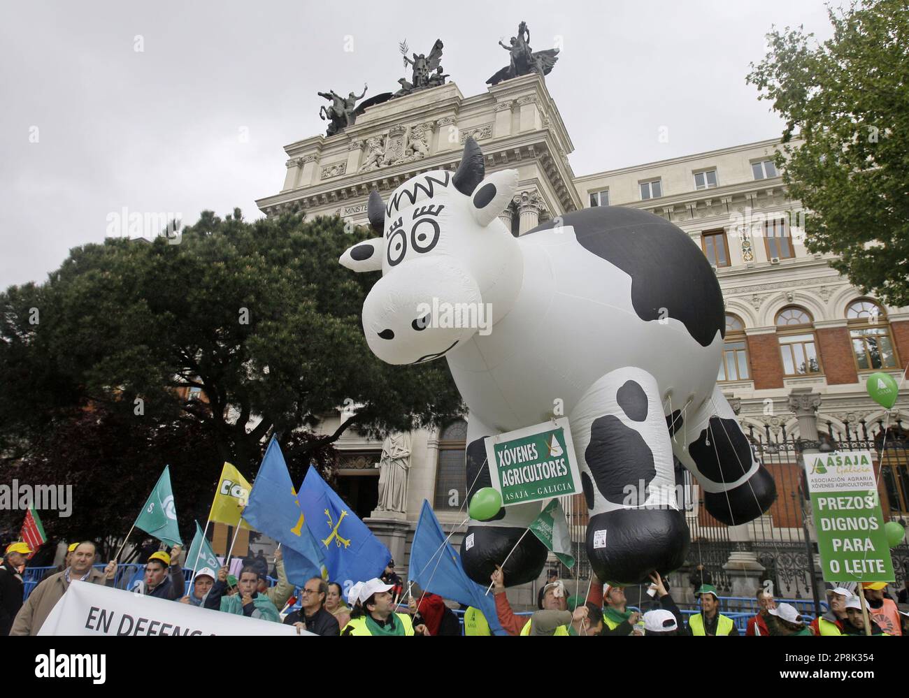 Dairy farmers protest with an inflatable cow outside the Agriculture ...