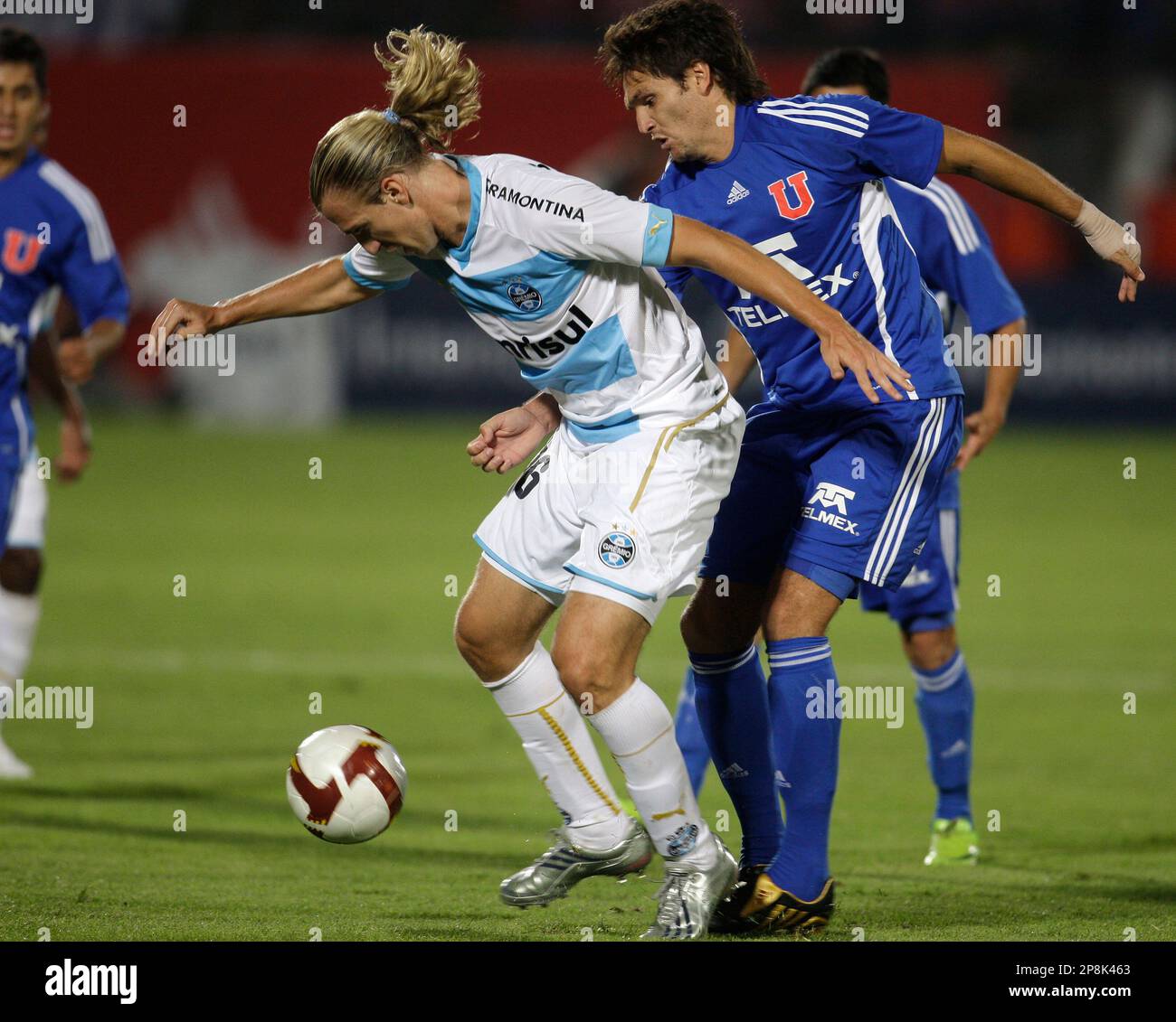 Brazil's Gremio's Maximilano Lopez, left, fights for the ball with ...