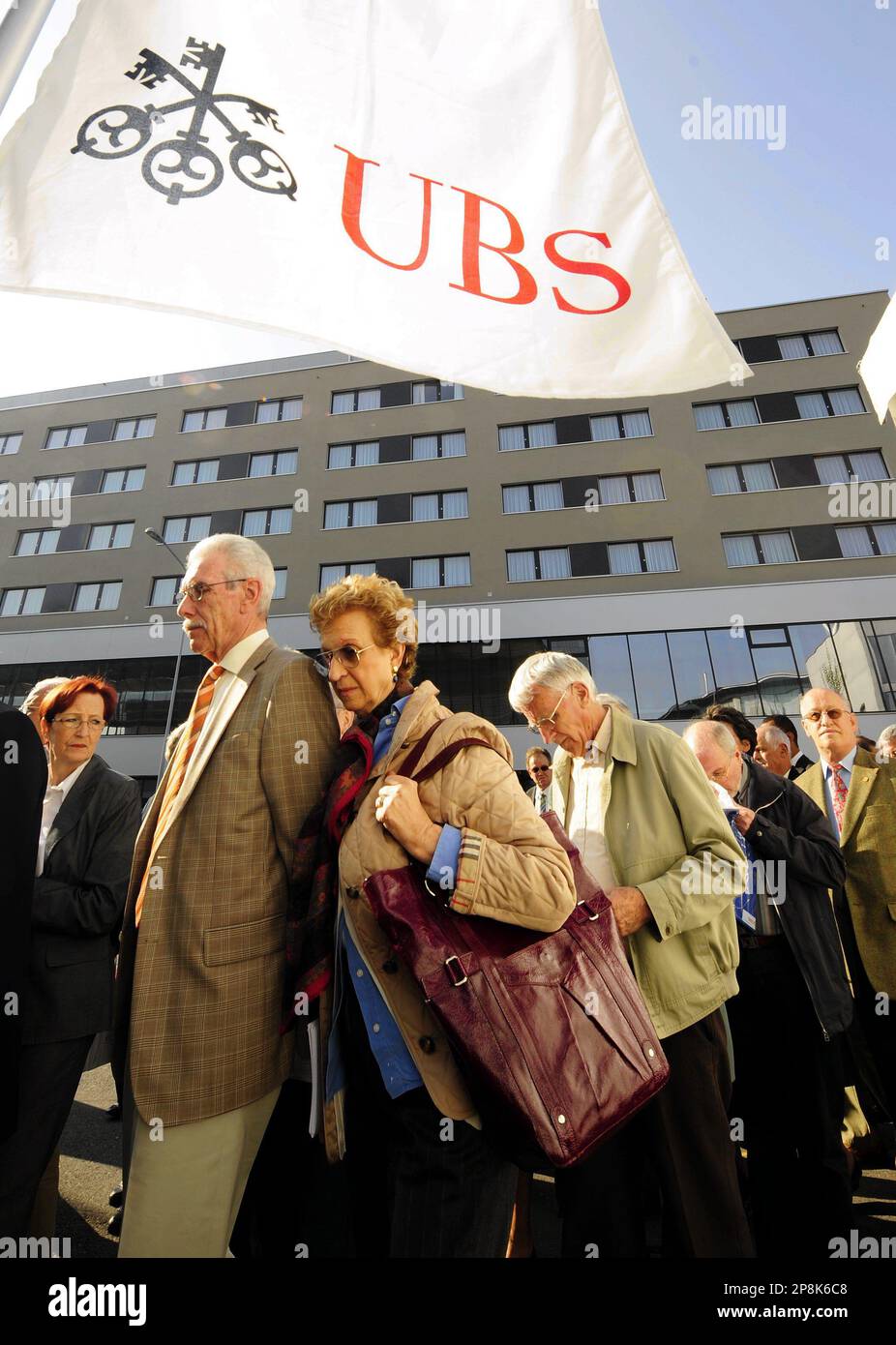 Shareholders arrive for the general assembly of Swiss bank UBS in ...
