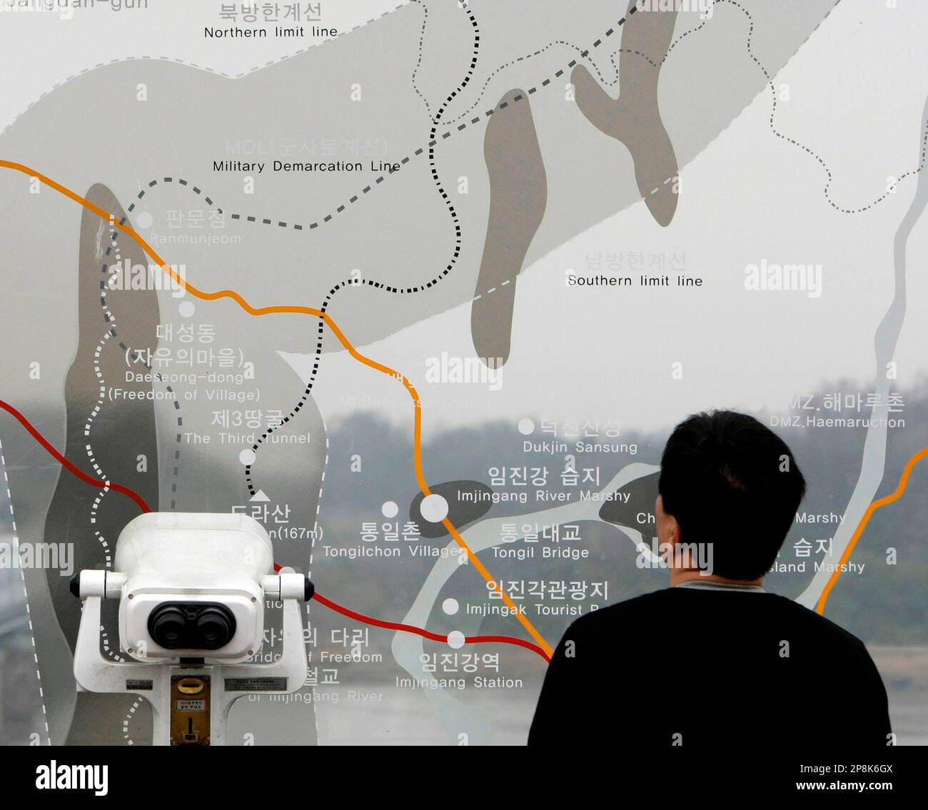 A tourist looks on a map of border area between two Koreas at the ...