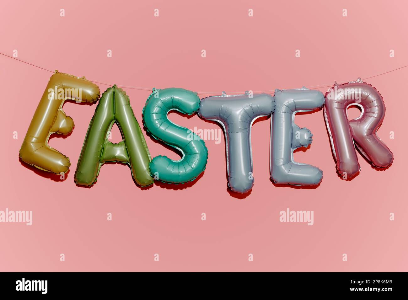 some alphabet-shaped balloons of different colors forming the word ...