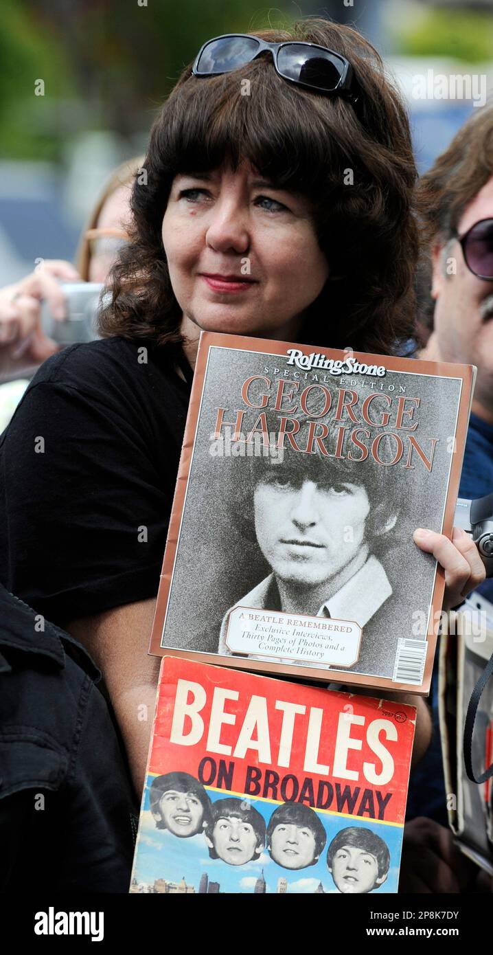 Gail Hale of Mesa, Ariz., holds signs during a posthumous Hollywood ...