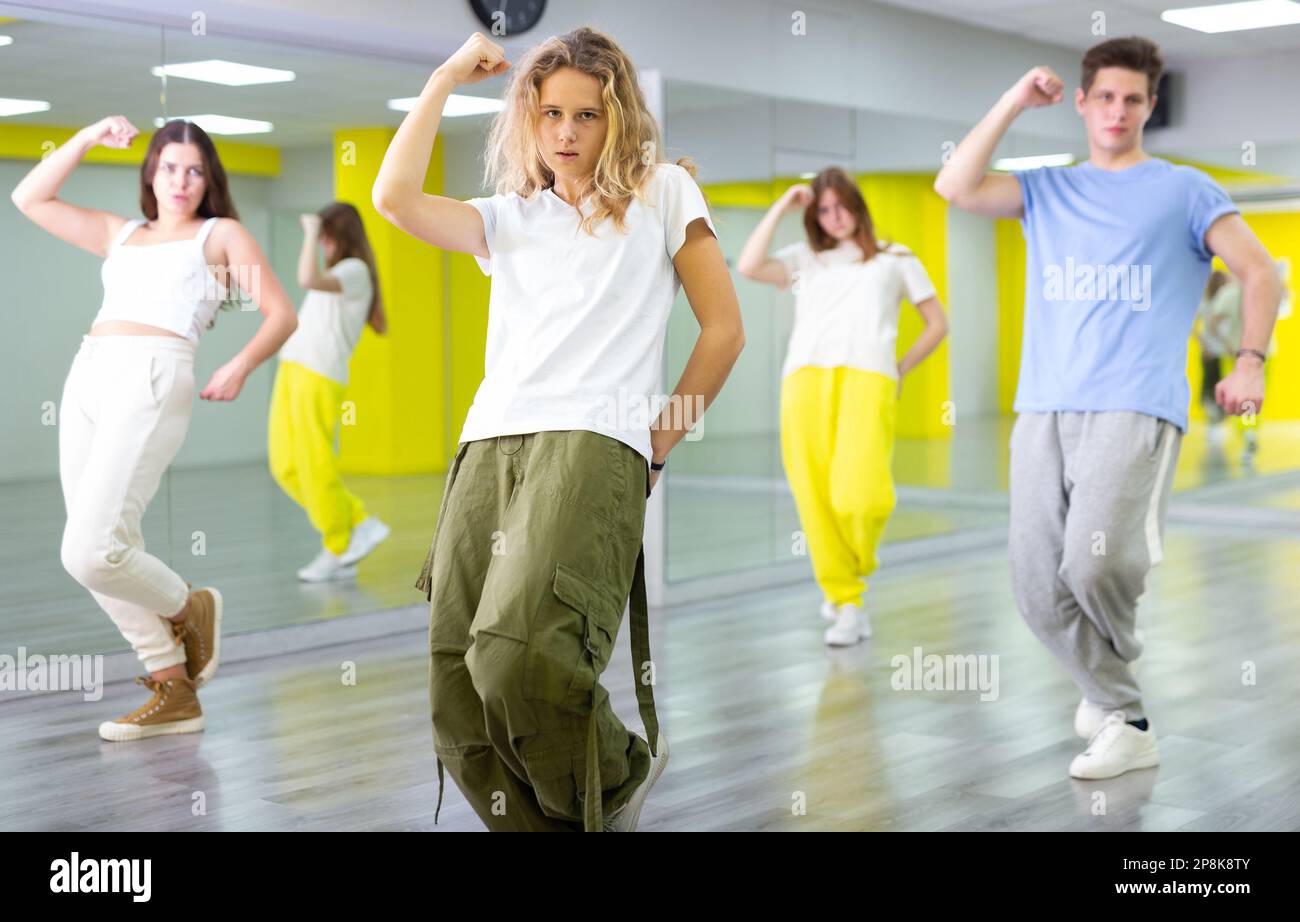Teenage girl training breakdance Toprock moves in dance hall Stock ...