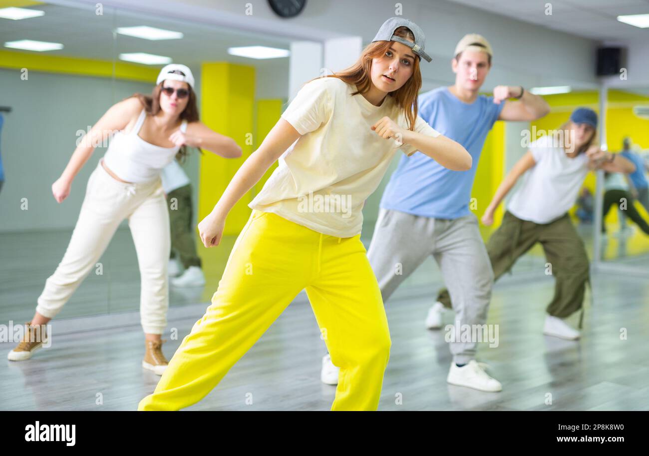 Teen girl in cap dances hip hop dances Stock Photo - Alamy