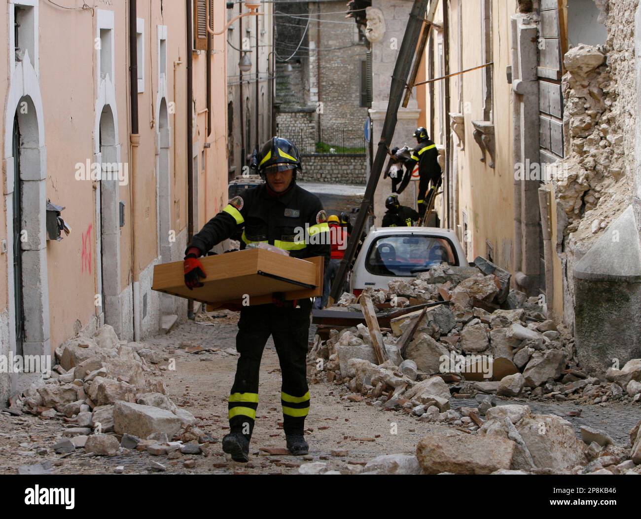 Firefighters collect belongings from the destroyed house of Roberta ...