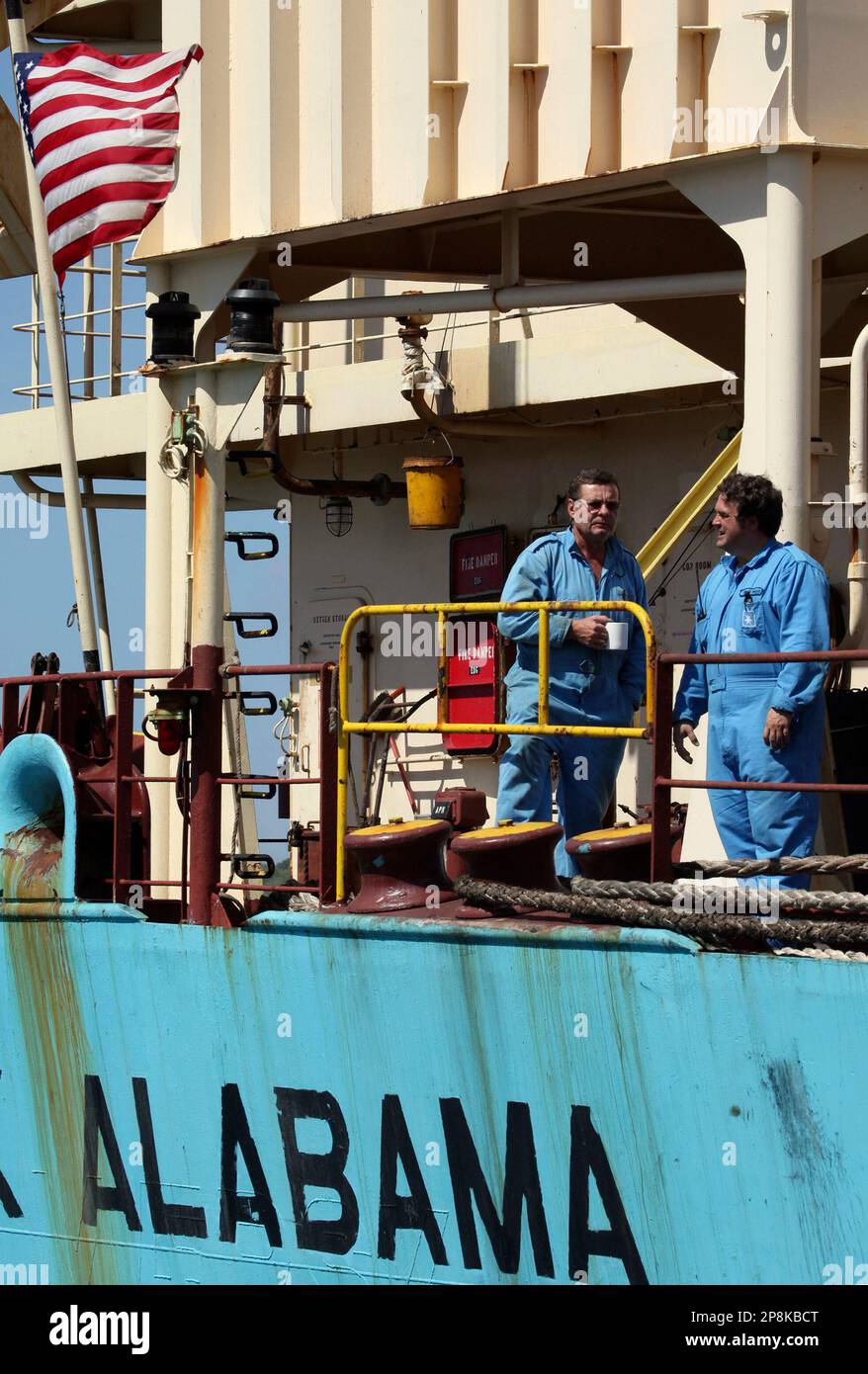 Unidentified crew members of the Maersk Alabama are seen on the ship's ...