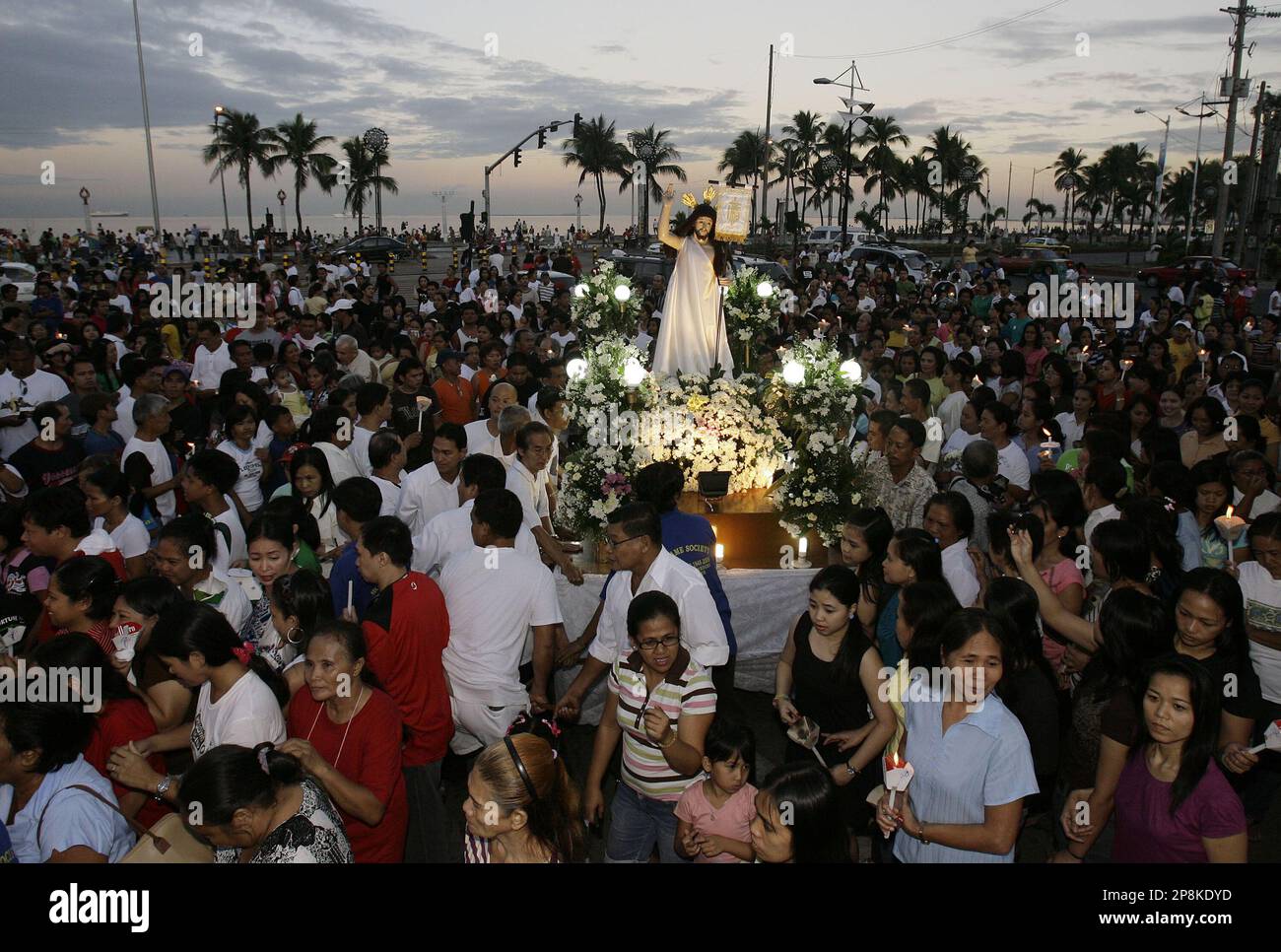 Filipino devotees join a procession of the "Risen Christ" during Easter ...