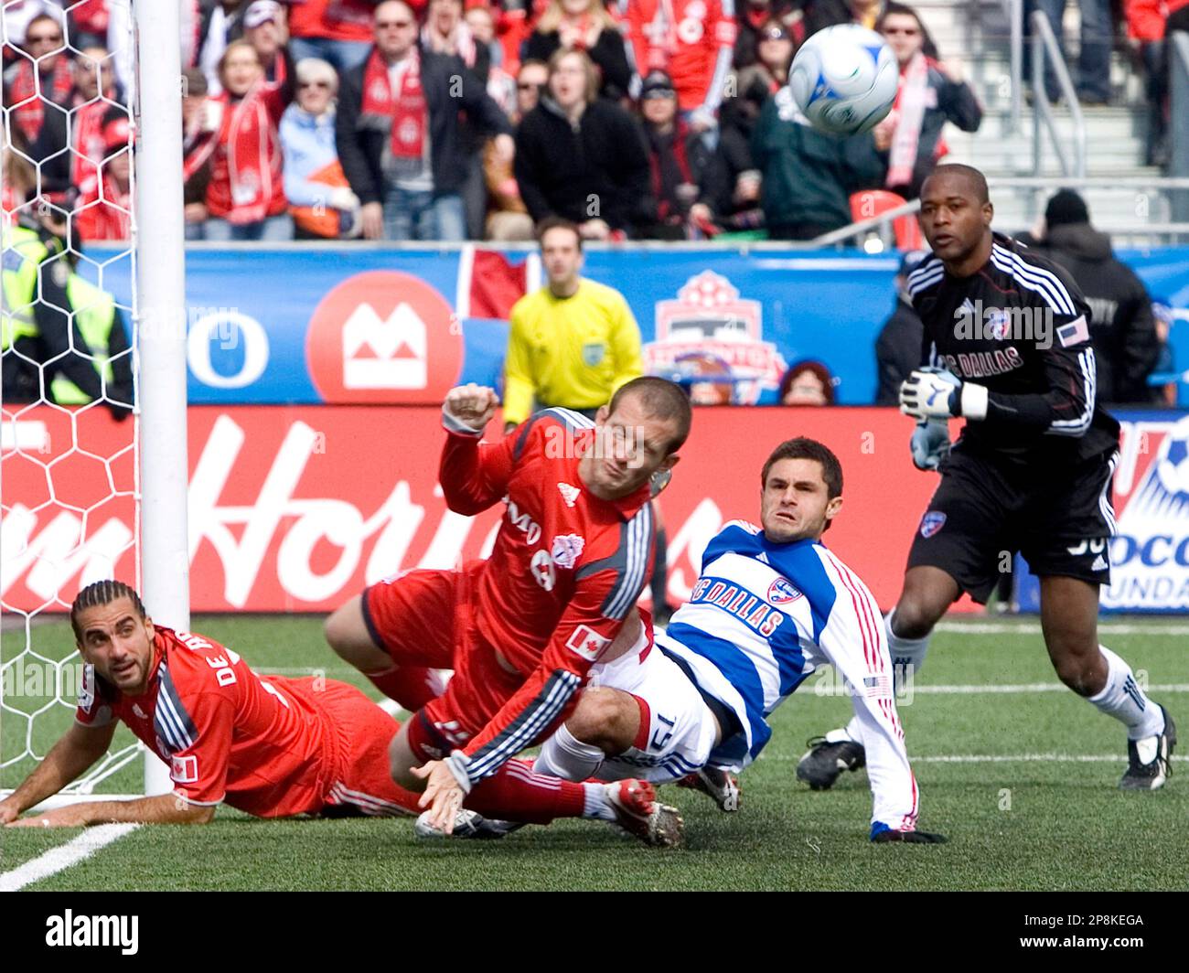 FC Dallas' Blake Wagner, center right, clears off the line to deny ...