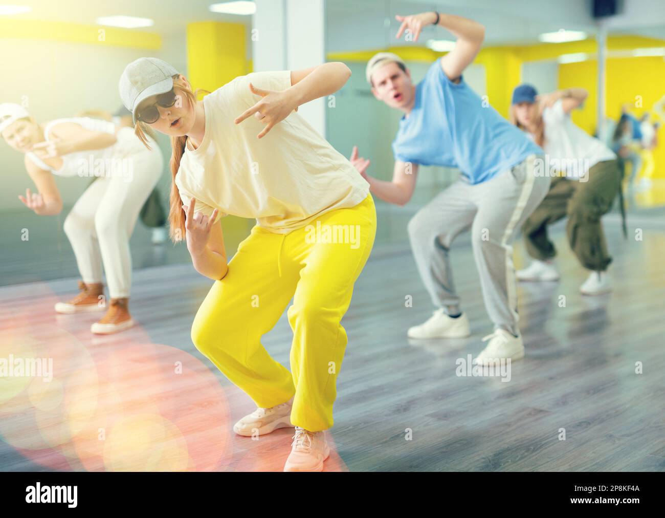 Teen girl in cap dances hip hop dances Stock Photo - Alamy