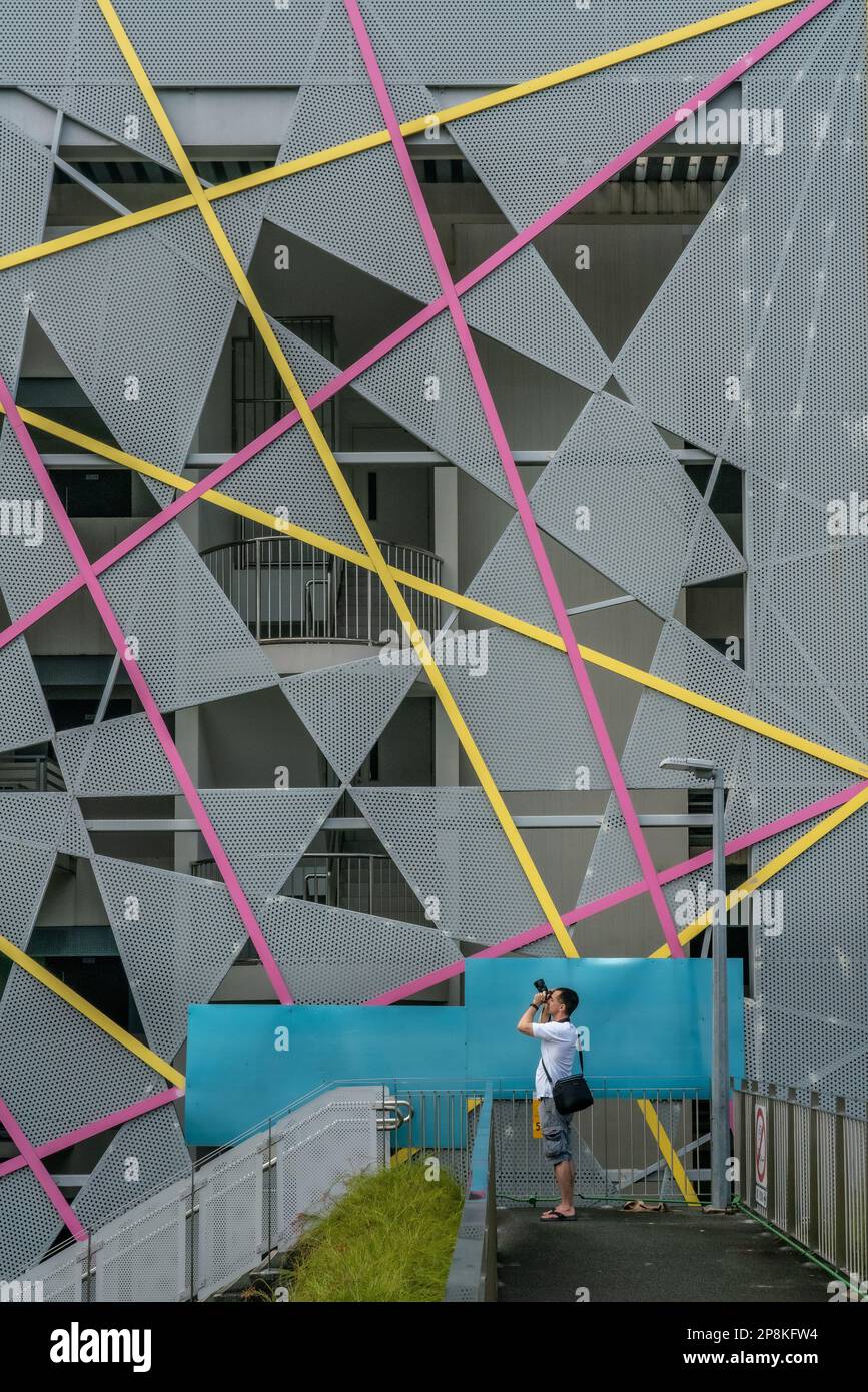 A Photographer is finding good angles for photo taking of the facade in ...