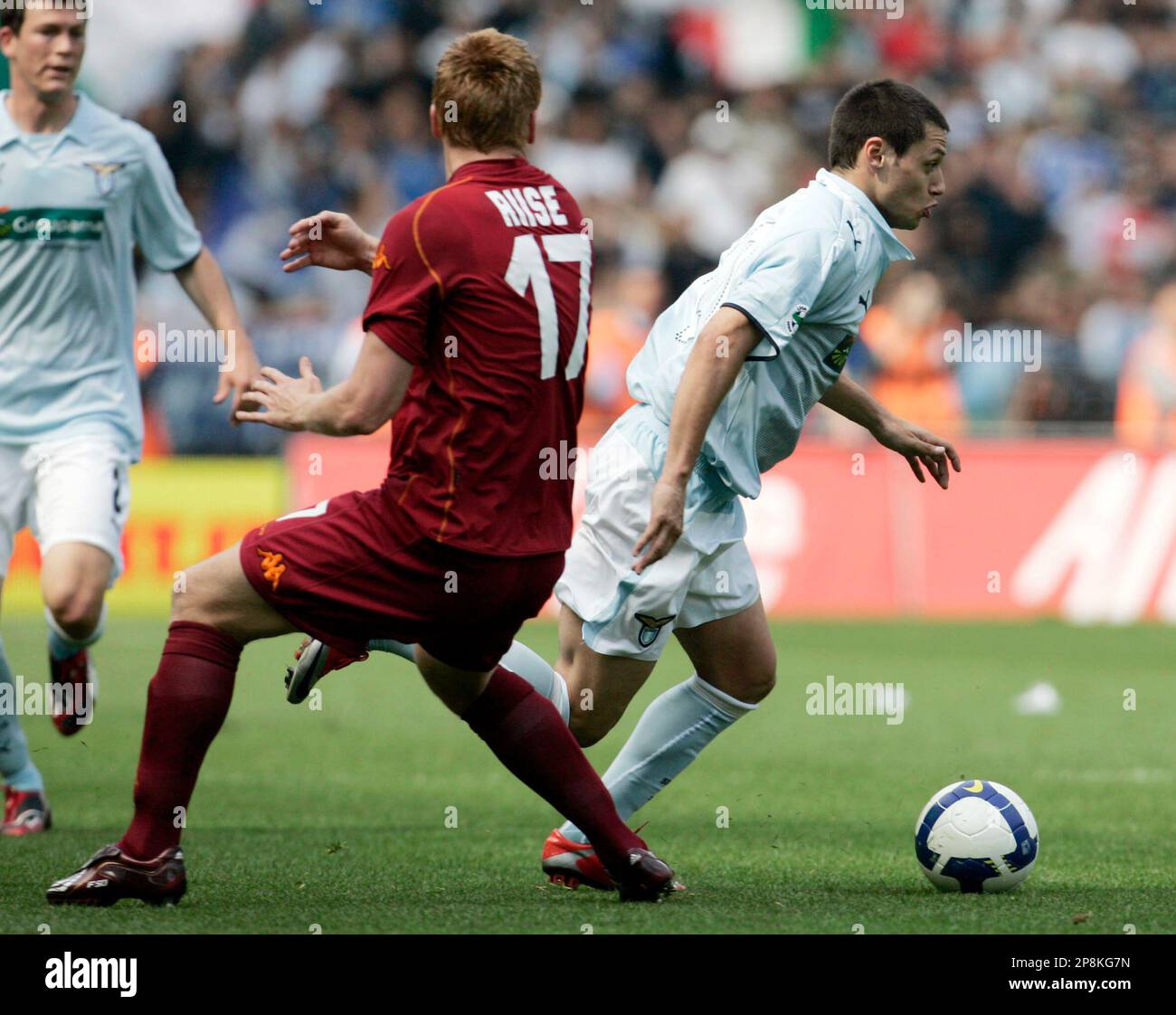 Lazio's Mauro Zarate of Argentina, right, controls the ball past AS ...
