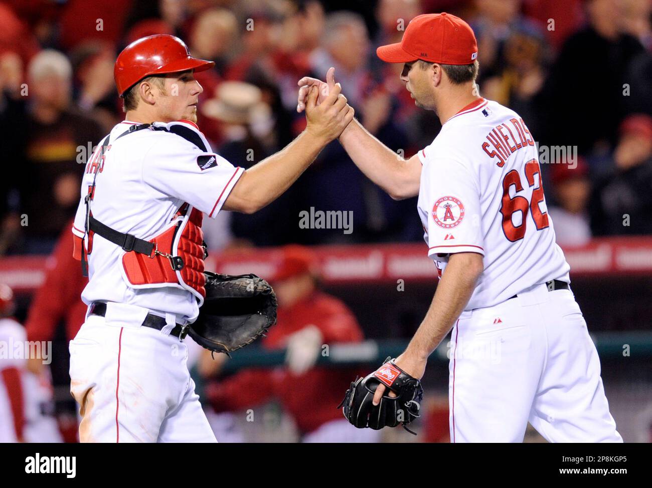 Los Angeles Angels pitcher Scot Shields, right, is congratulated by ...