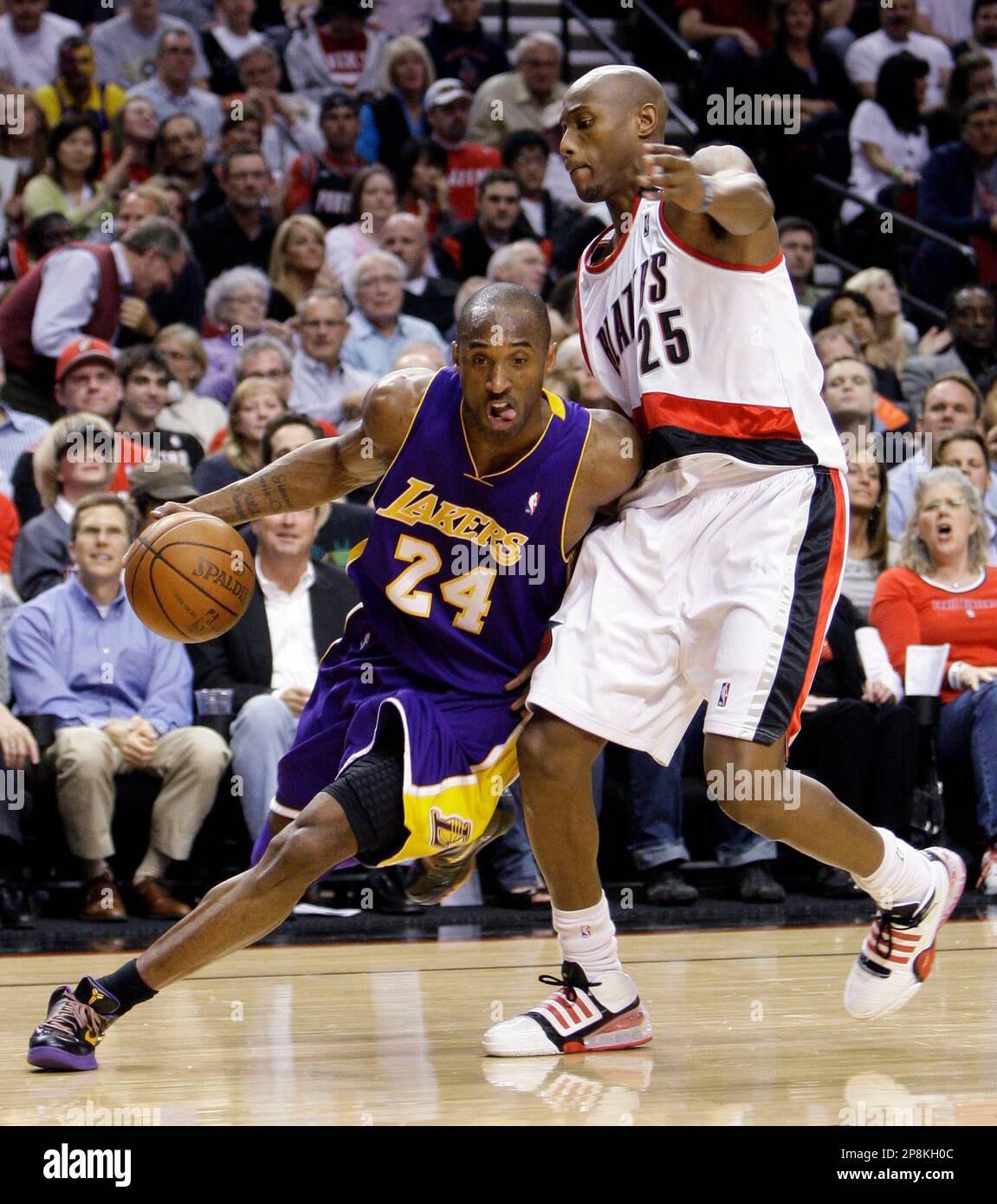 Los Angeles Lakers' Kobe Bryant (24) drives past Portland Trail Blazers ...