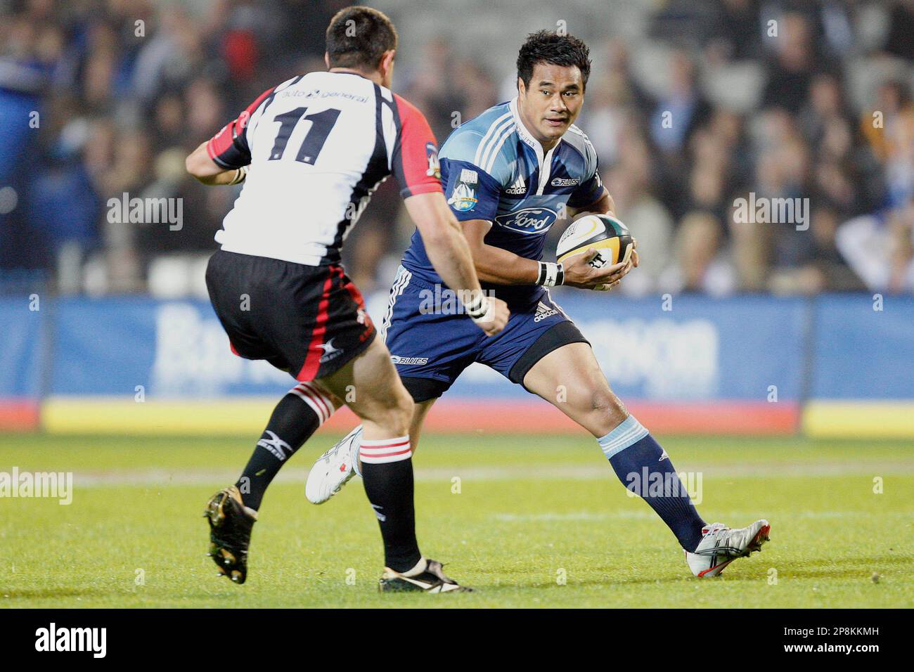Blues' Isaia Toeava looks to get past Lions' Henno Mentz during a Super ...