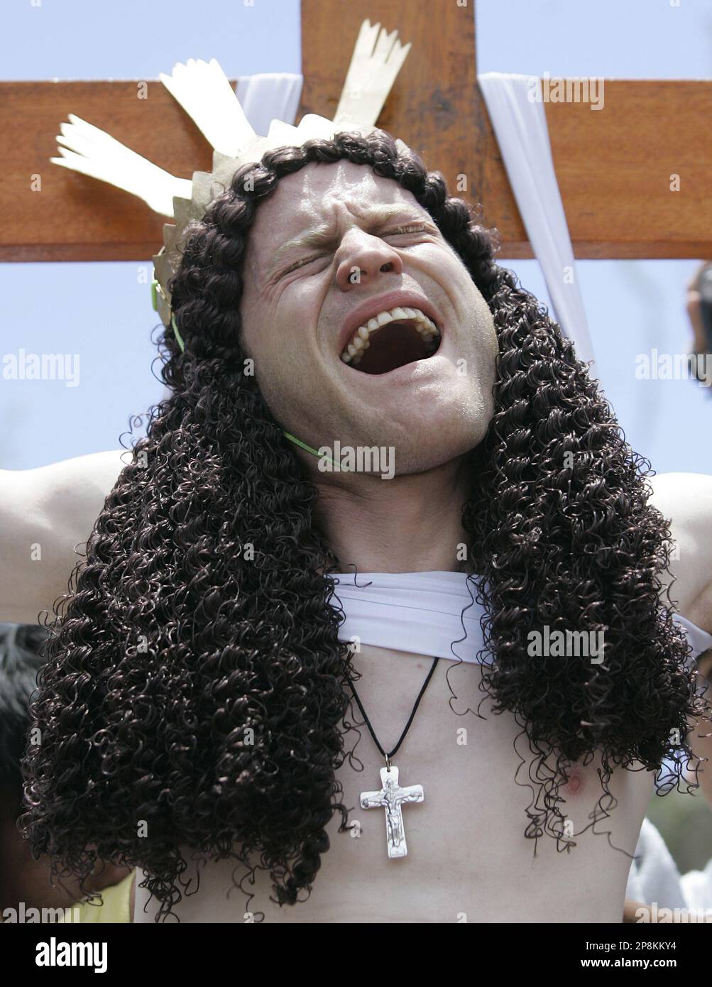 John Michael, a 33-year-old Australian from Melbourne, cries in pain as ...