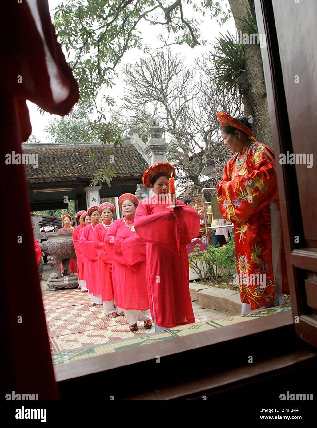 Women wearing Vietnamese traditional costume are seen during rituals in ...