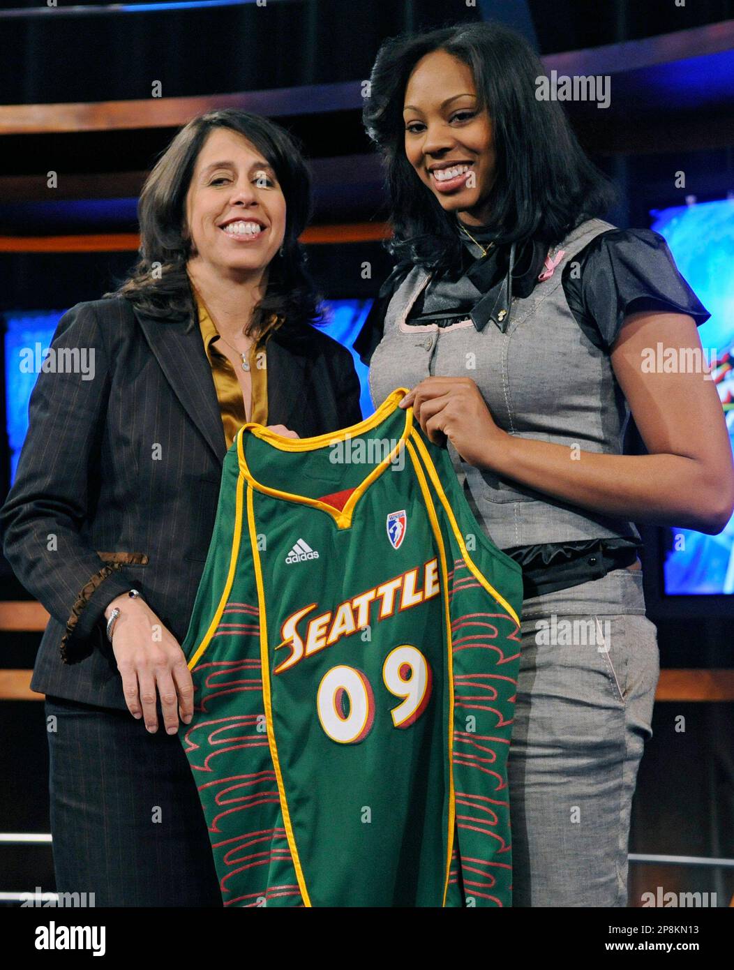 California's Ashley Walker, right, holds up a Seattle Storm jersey as ...