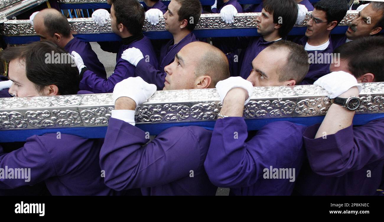 Penitent carry a platform with a figure of Jesus out of the Pedro el ...