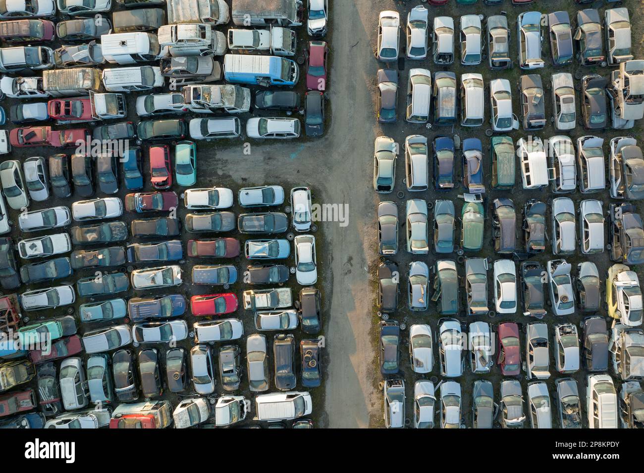 Aerial view of big parking lot of junkyard with rows of discarded ...