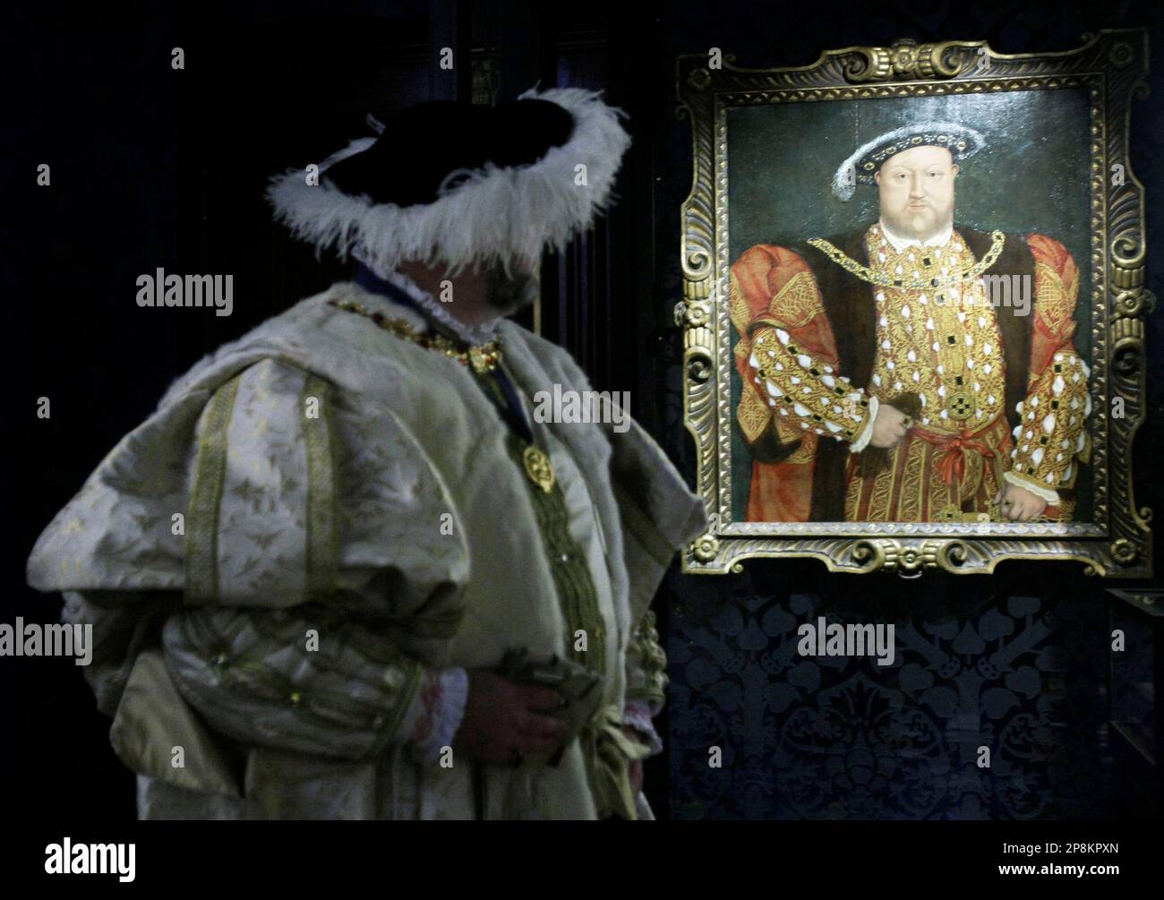 Costumed interpreter Richard Evans, as Britain's King Henry VIII, poses ...