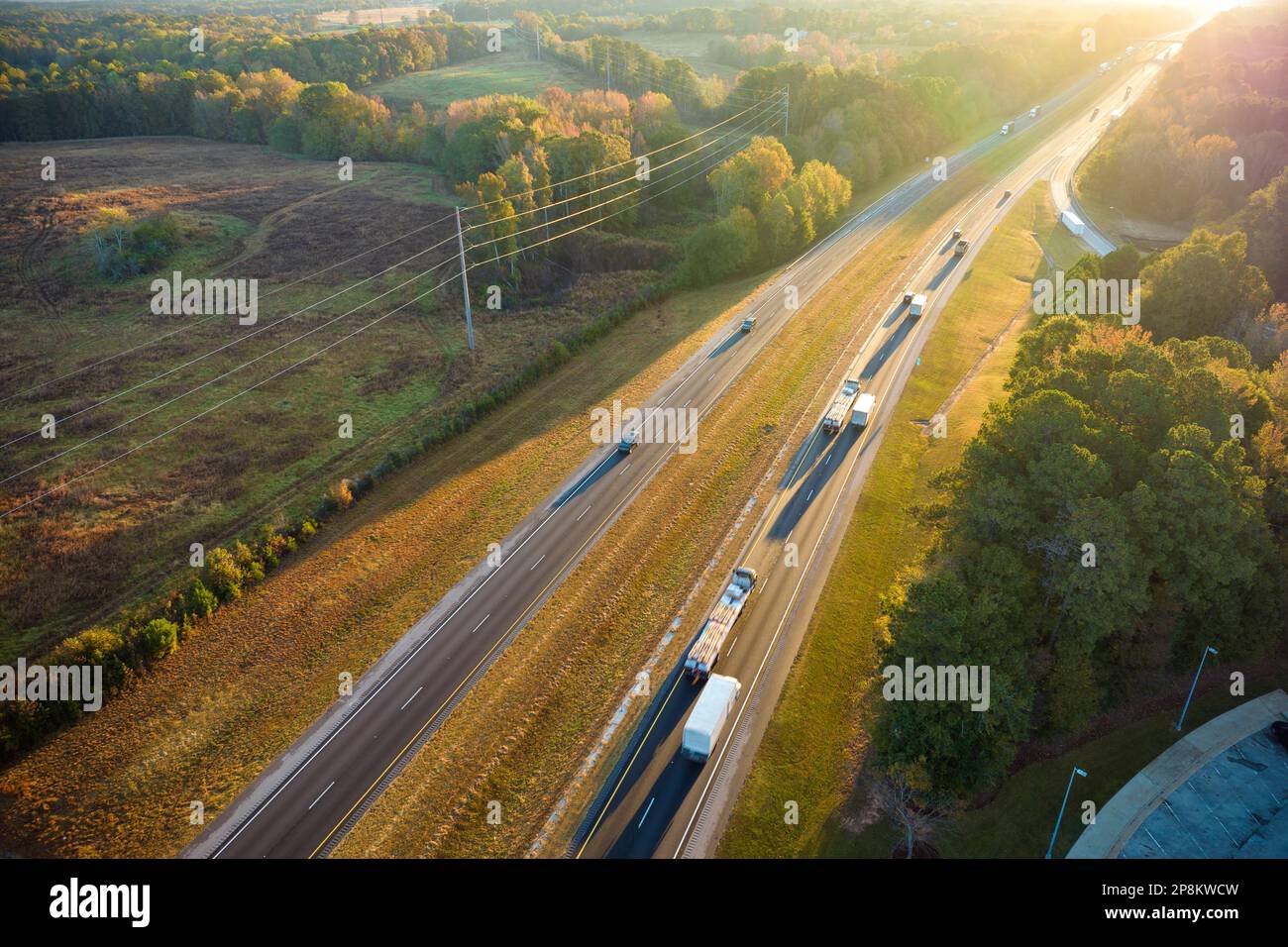 Aerial view of busy american freeway with fast moving cars and trucks ...