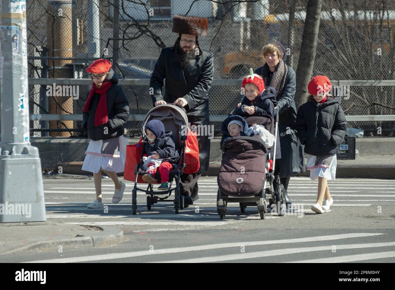 The children of a Hasidic Jewish couple celebrate Purim by wearing ...