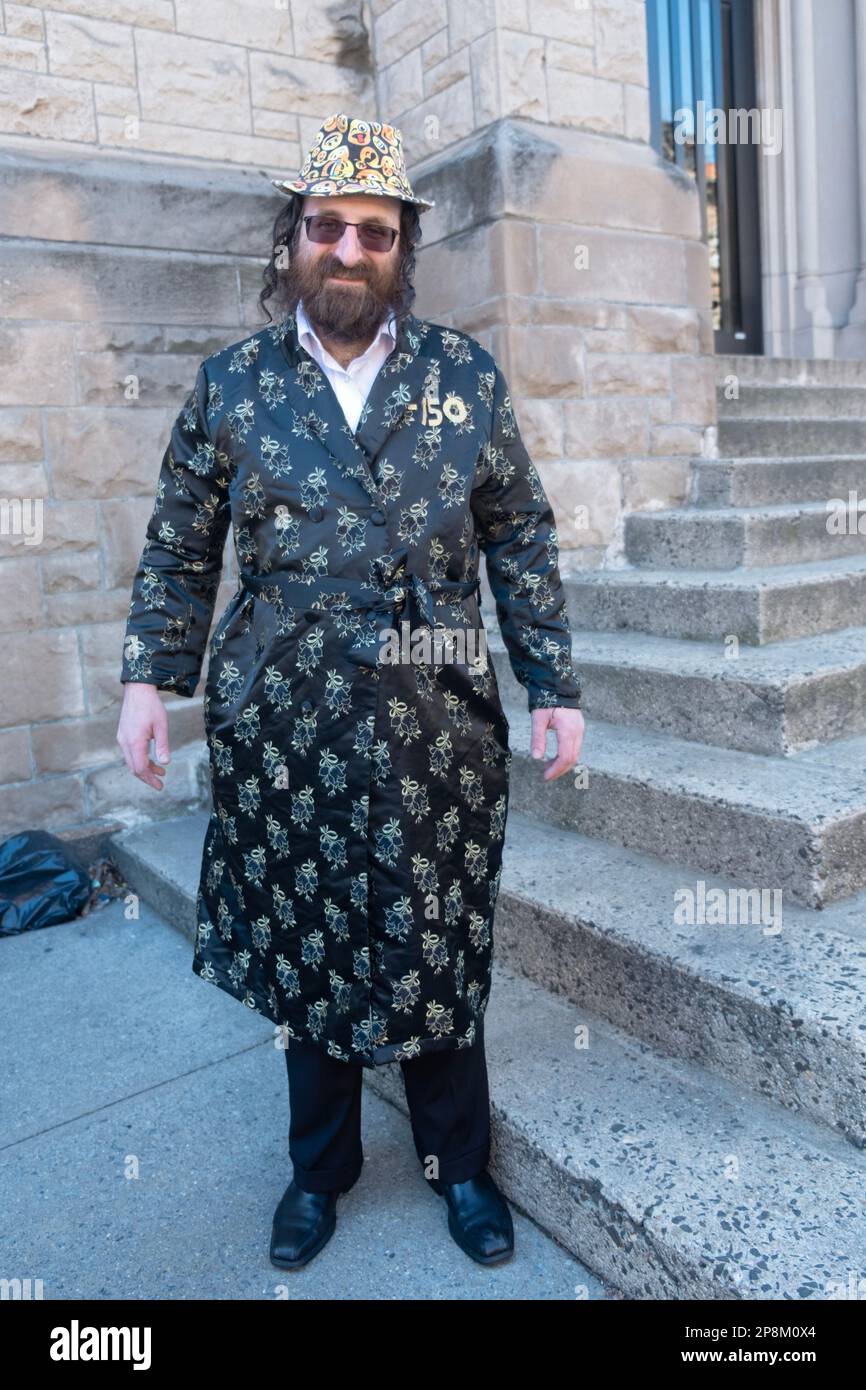 Posed portrait of a Hasidic Jewish man with peyus wearing a costume on ...