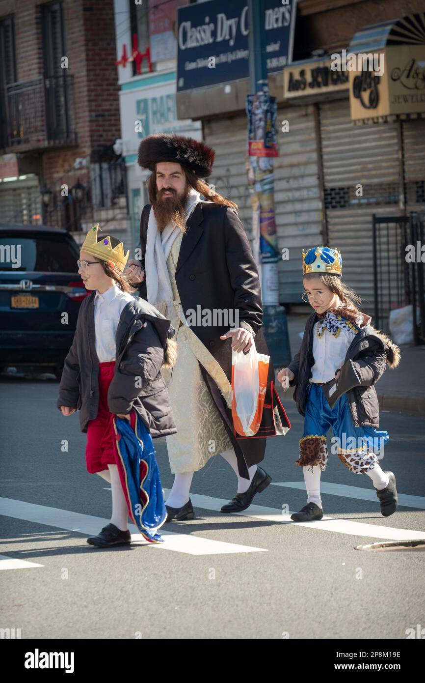 The children of a Hasidic Jewish man celebrate Purim by wearing ...