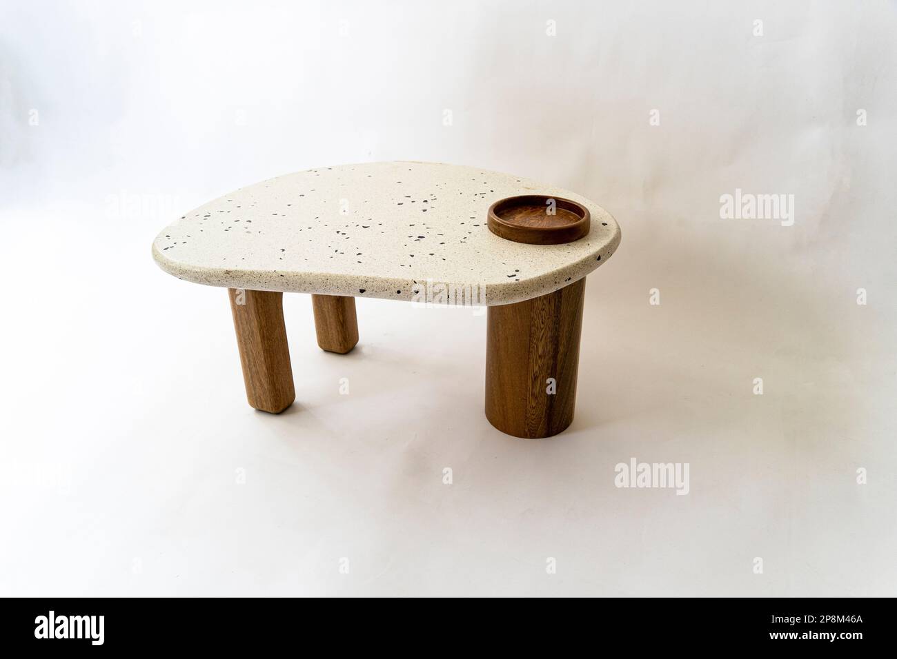 An abstract modern coffee table with wooden legs Stock Photo - Alamy