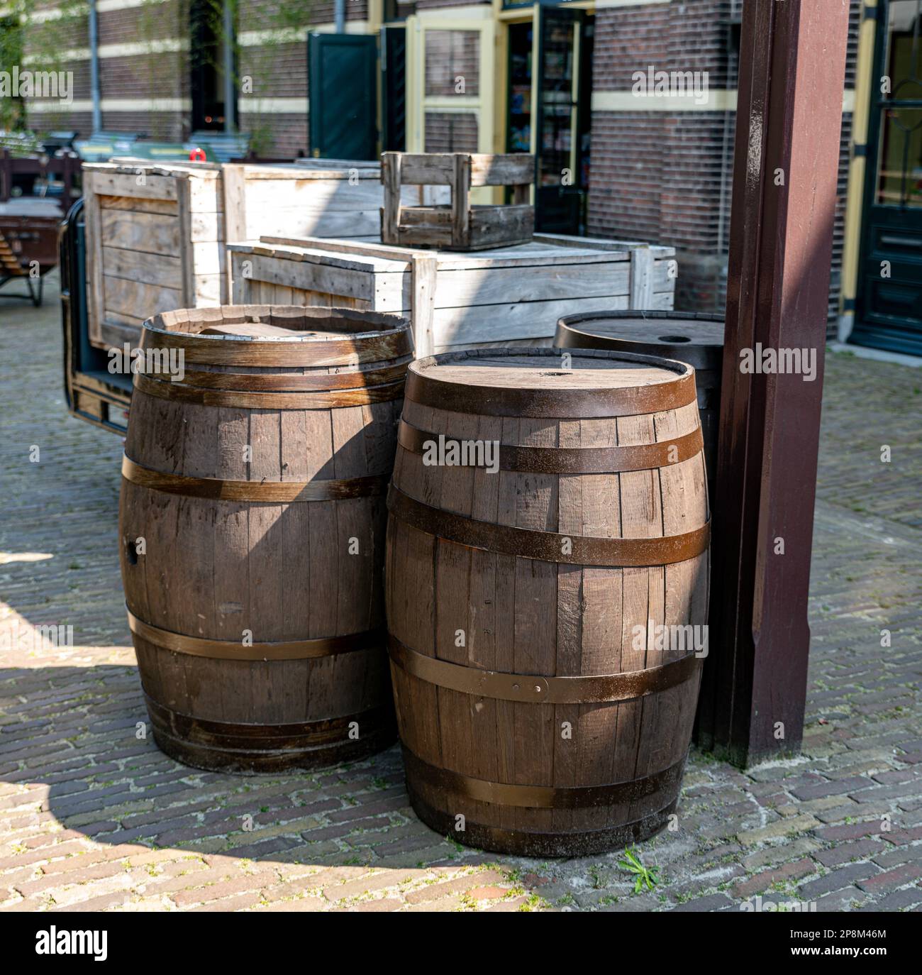 some wooden wine barrels outside in the sun Stock Photo - Alamy