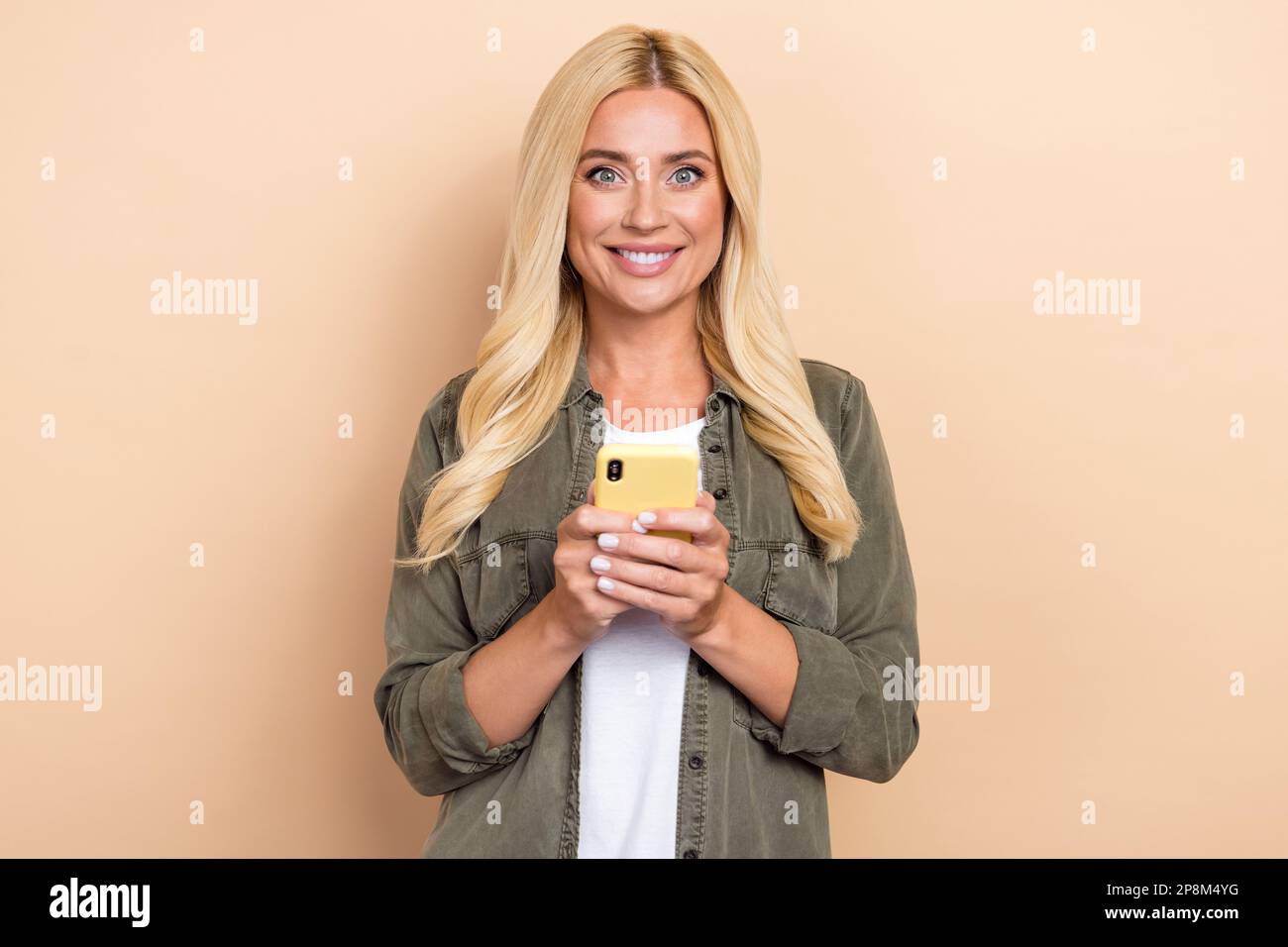 Photo of pretty cute woman wear khaki shirt chatting instagram twitter ...