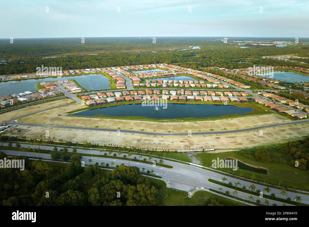 Aerial view of real estate development with tightly located family ...