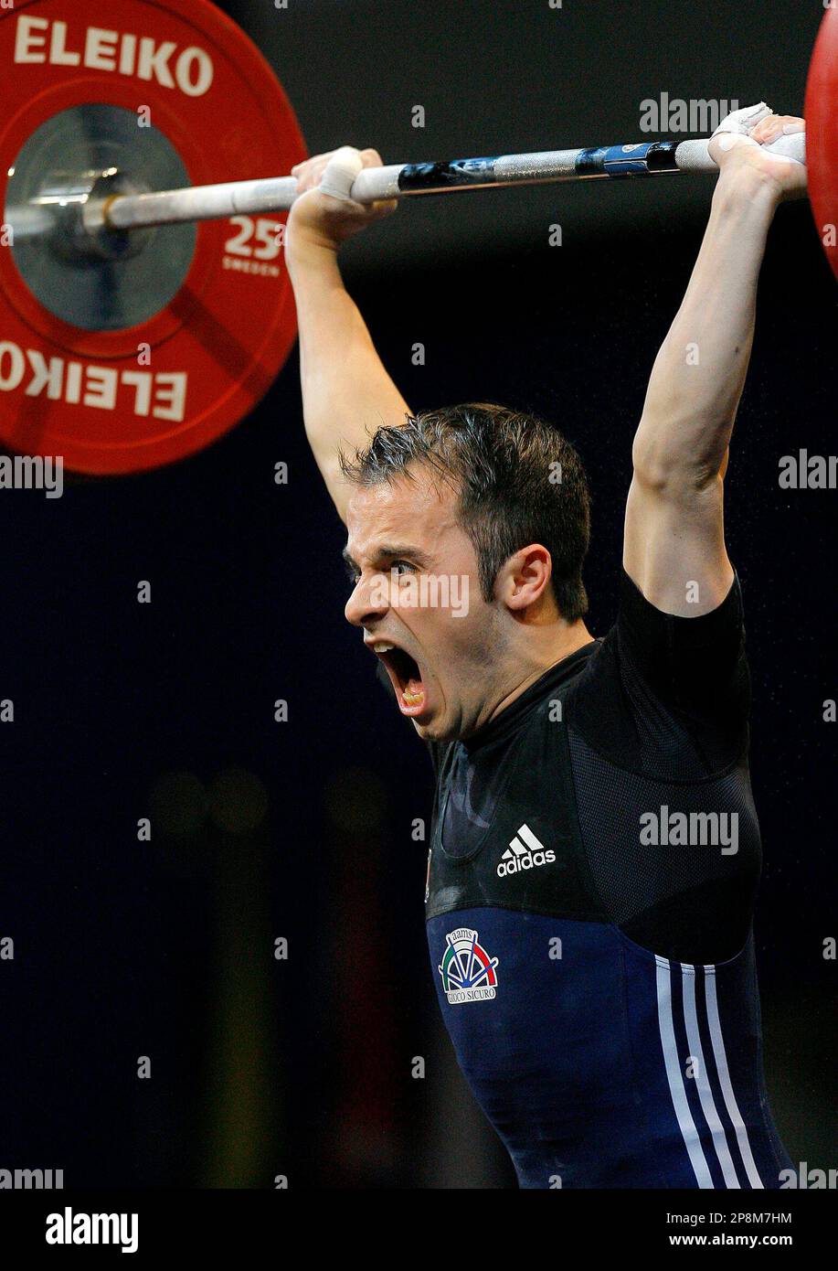 Vito Dellino, of Italy, makes an attempt during the 56 kilograms finals ...