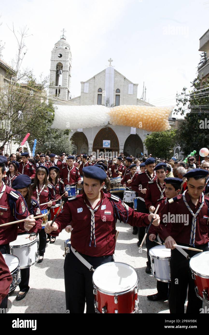 Syrian scouts beat drums during the celebration of Palm Sunday outside ...