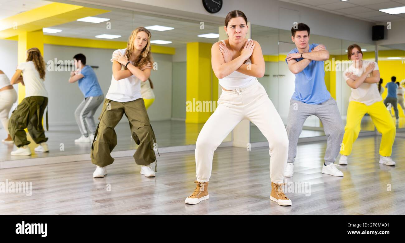 Young girl training breakdance Toprock moves in dance hall Stock Photo ...