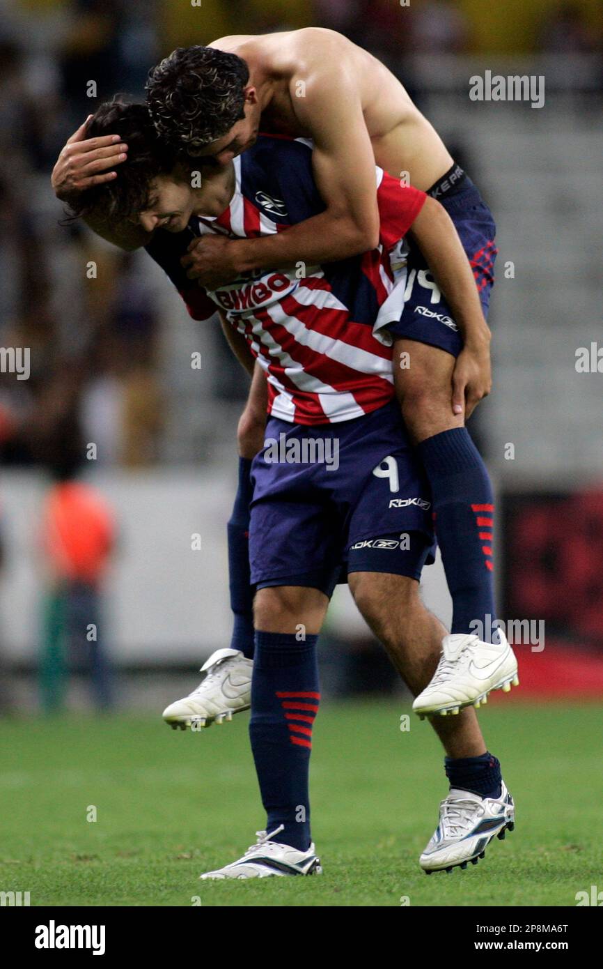 Chivas' Jonny Magallon, top, and Omar Arellano celebrate at the end of ...