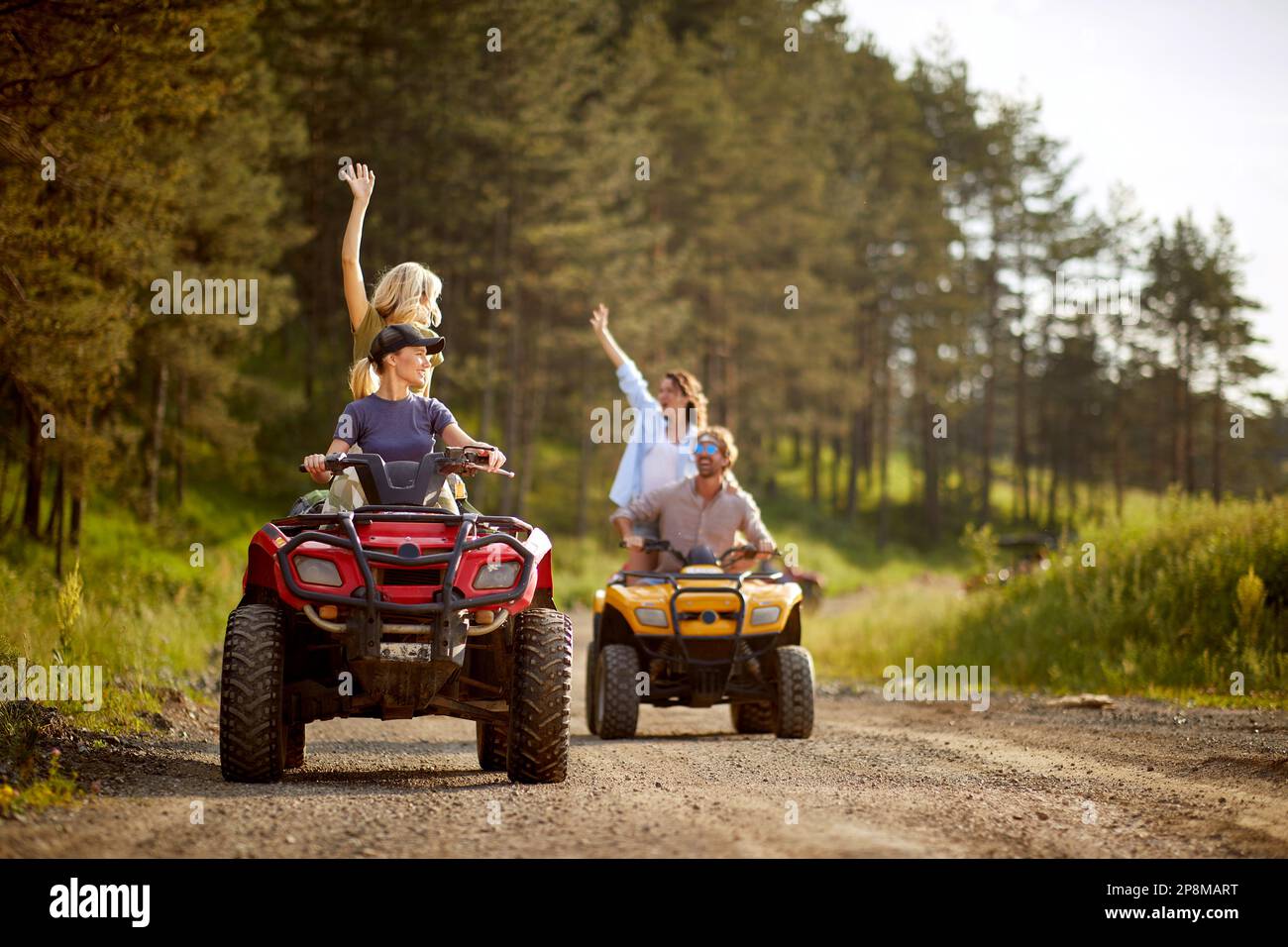 Group of caucasian friends driving quads together in the nature Stock ...