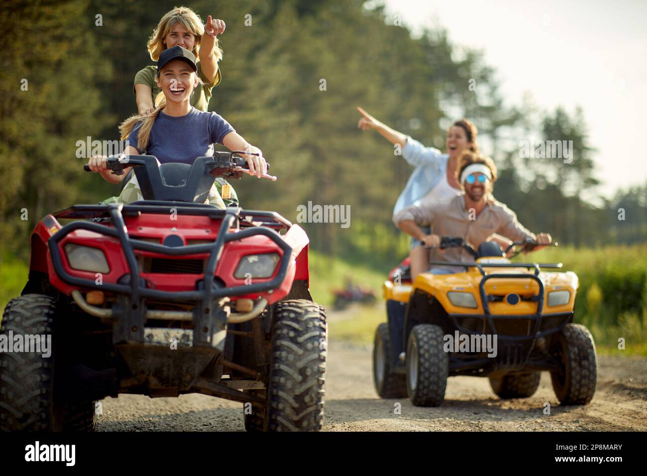 Group of active friends driving quads together in the nature Stock ...