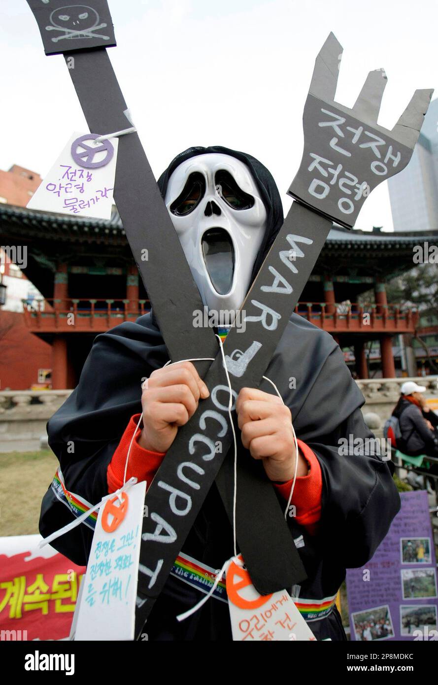 An anti-war protester stages an anti-war rally denouncing the U.S.-led ...