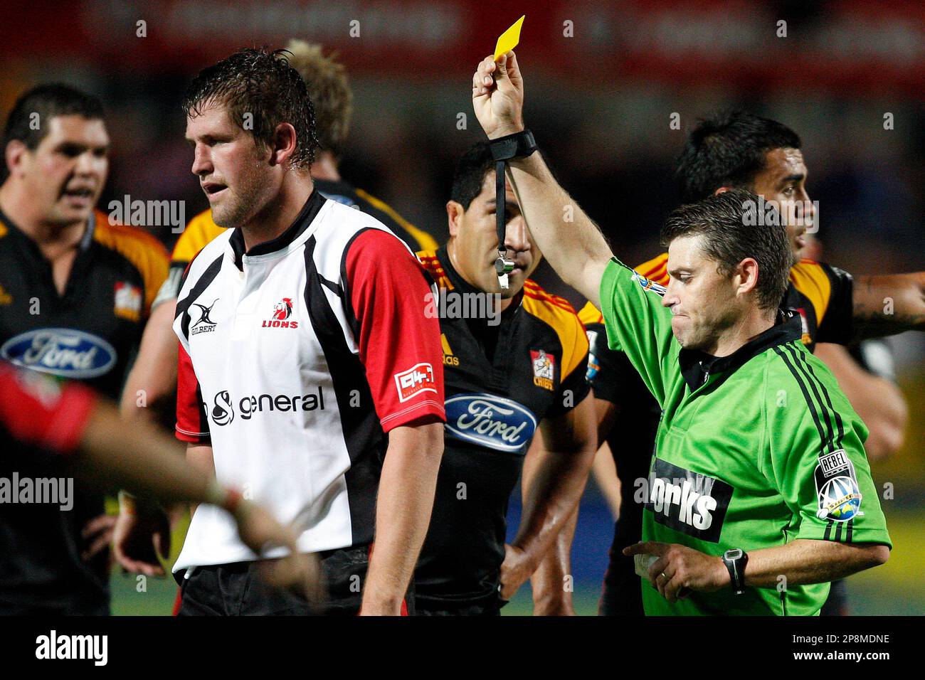 Lions' Ernst Joubert is shown the yellow card by Referee Paul Marks ...