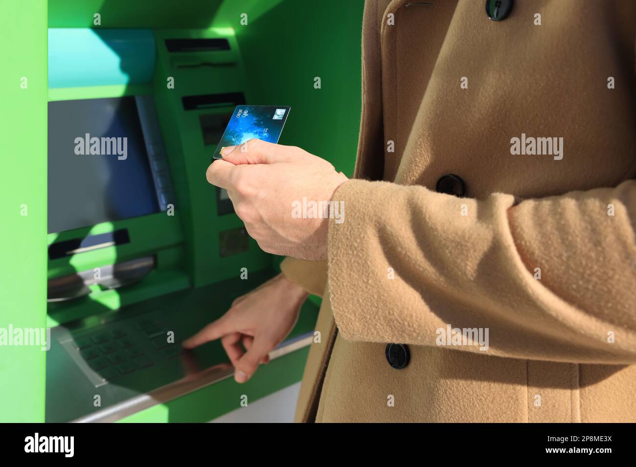 Man with debit card using modern cash machine, closeup of hand Stock ...
