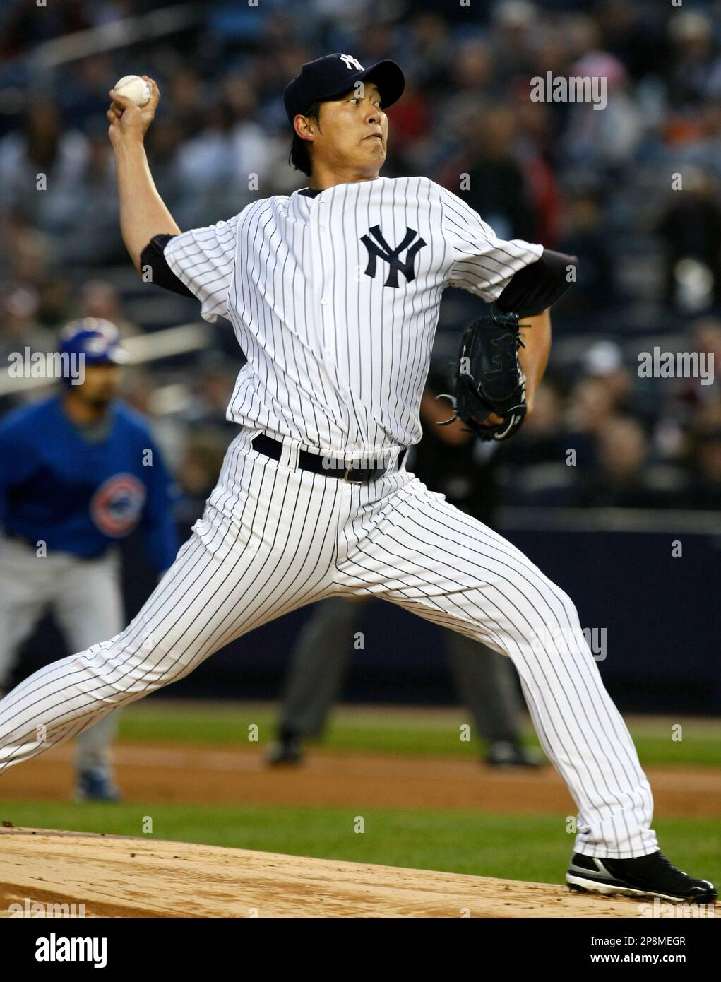 New York Yankees pitcher Chien-Ming Wang delivers a pitch in the first ...