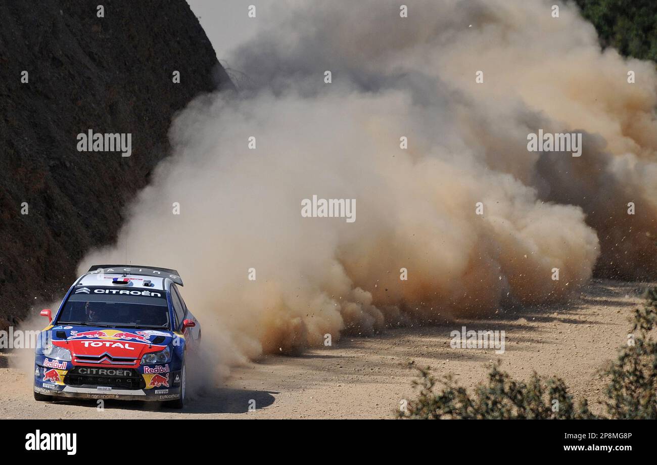 Sebastien Loeb of France and his co-driver Daniel Elena drive their ...