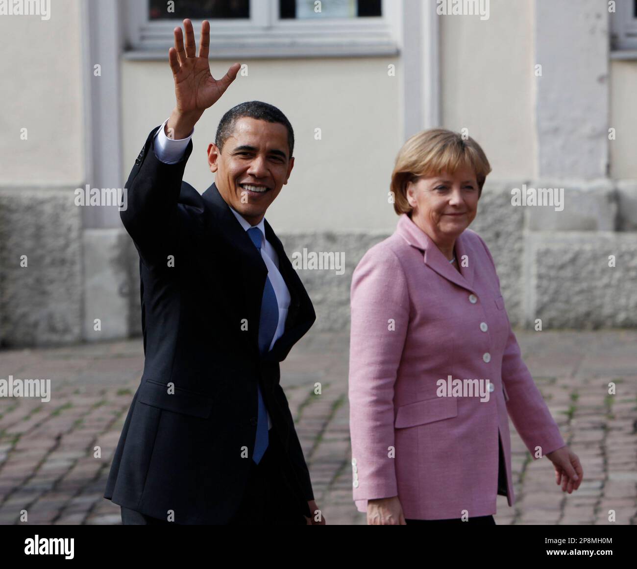 President Barack Obama waves as he walks with German Chancellor Angela ...
