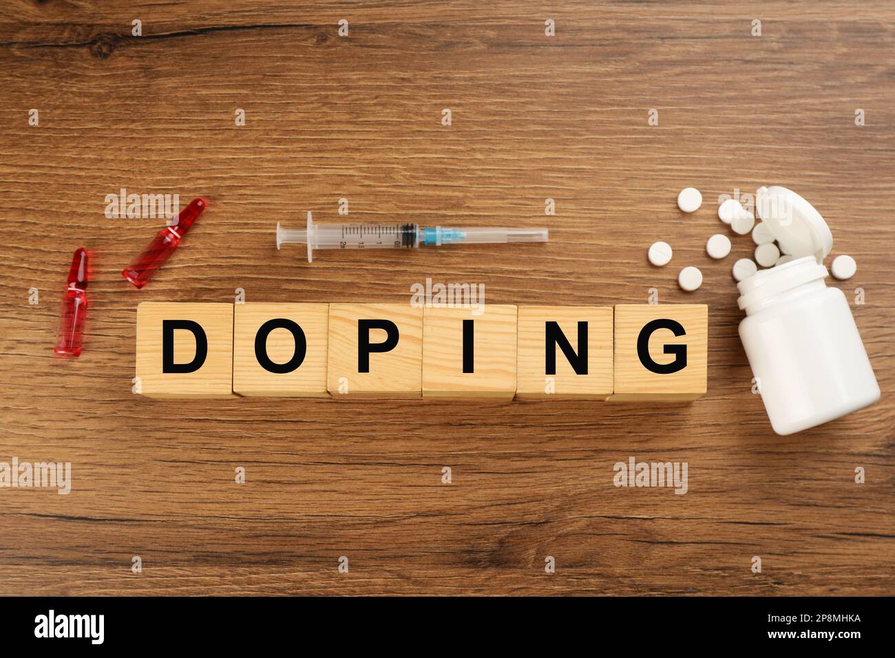 Cubes with word Doping and drugs on wooden background, flat lay Stock ...