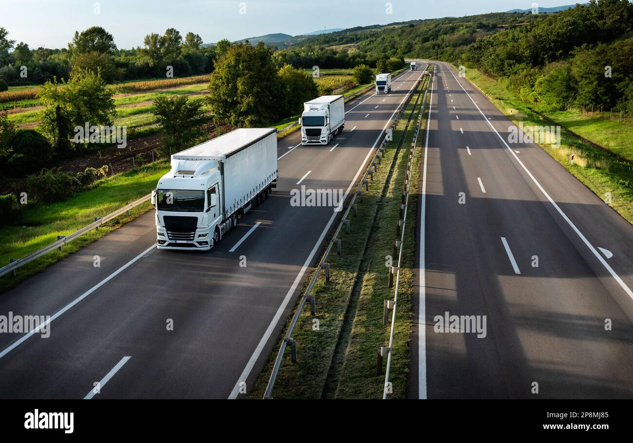 Convoy of Trucks with containers on highway, cargo transportation ...