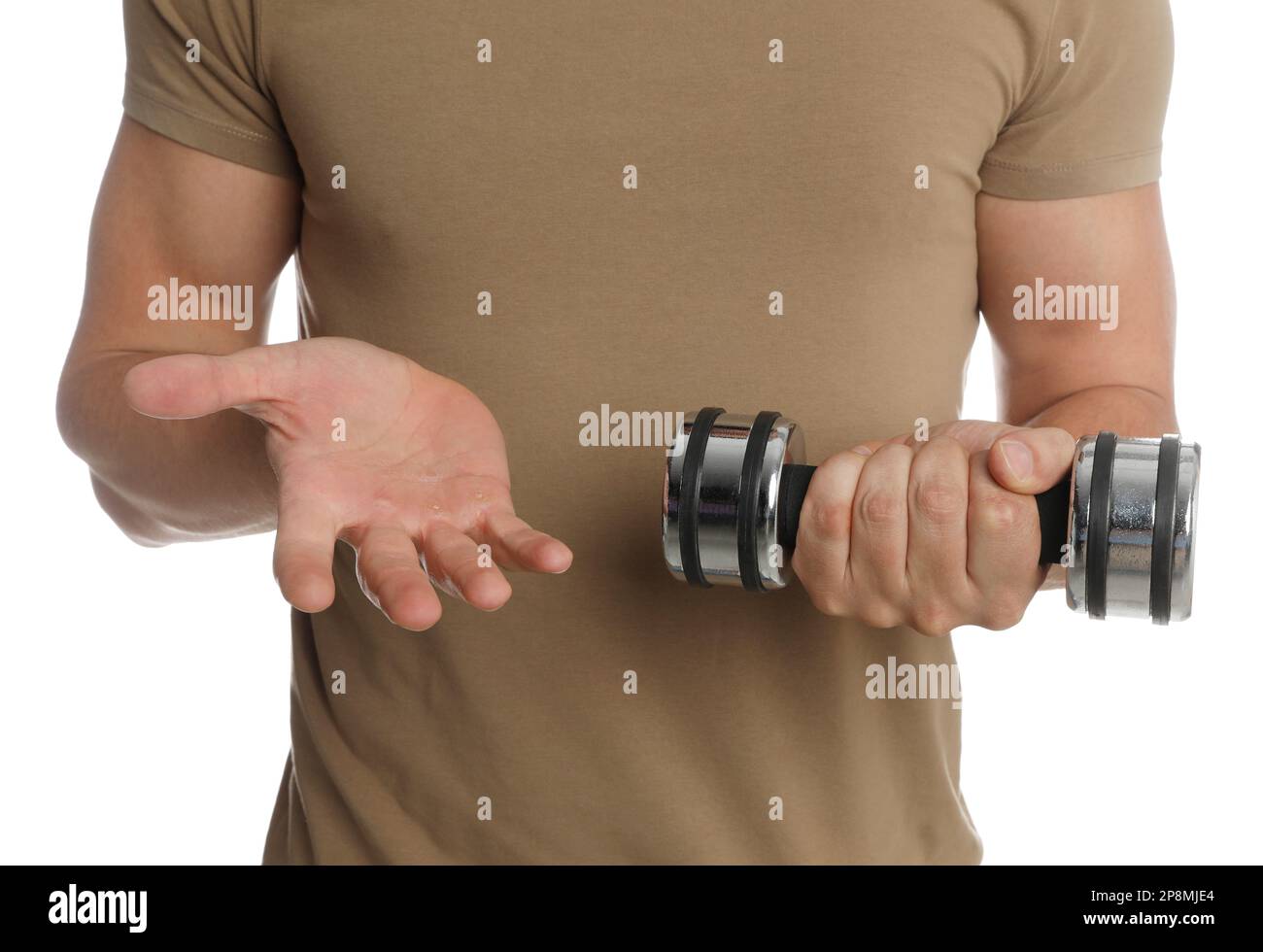 Sporty man with dumbbell suffering from calluses on hands against white ...