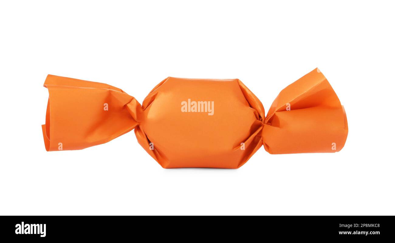 Delicious candy in orange wrapper isolated on white Stock Photo - Alamy