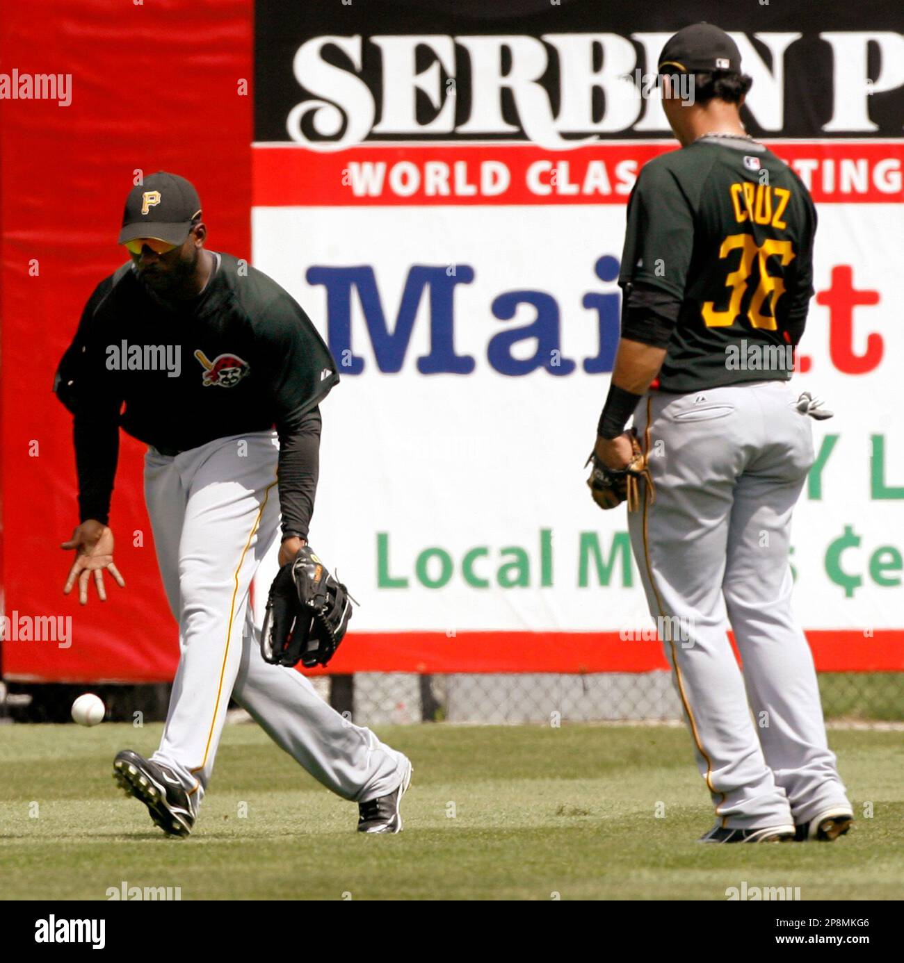 A fly ball by Cincinnati Reds' Daniel Ray Herrera drops in front of ...